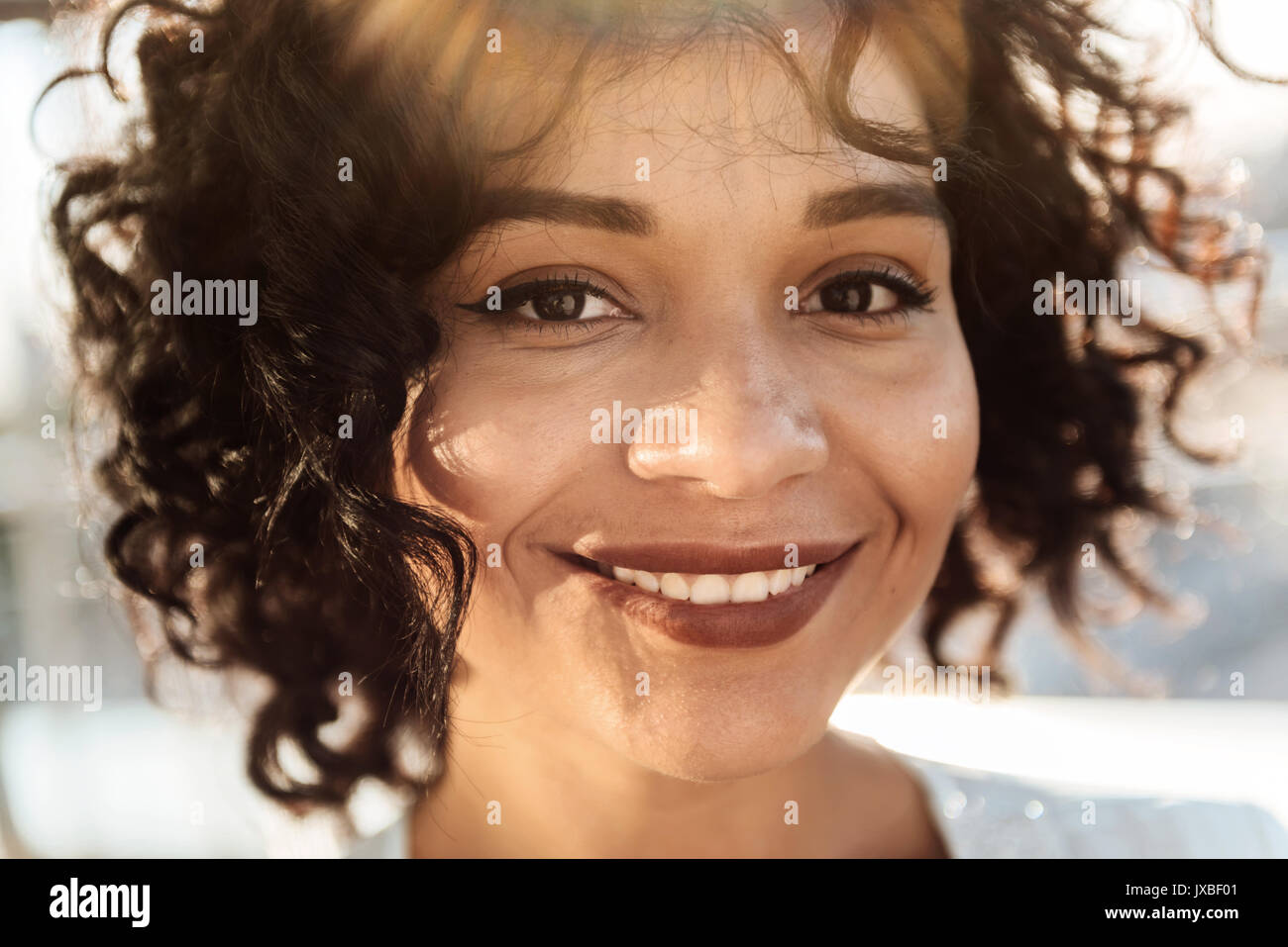 Positive cheerful woman smiling Stock Photo - Alamy