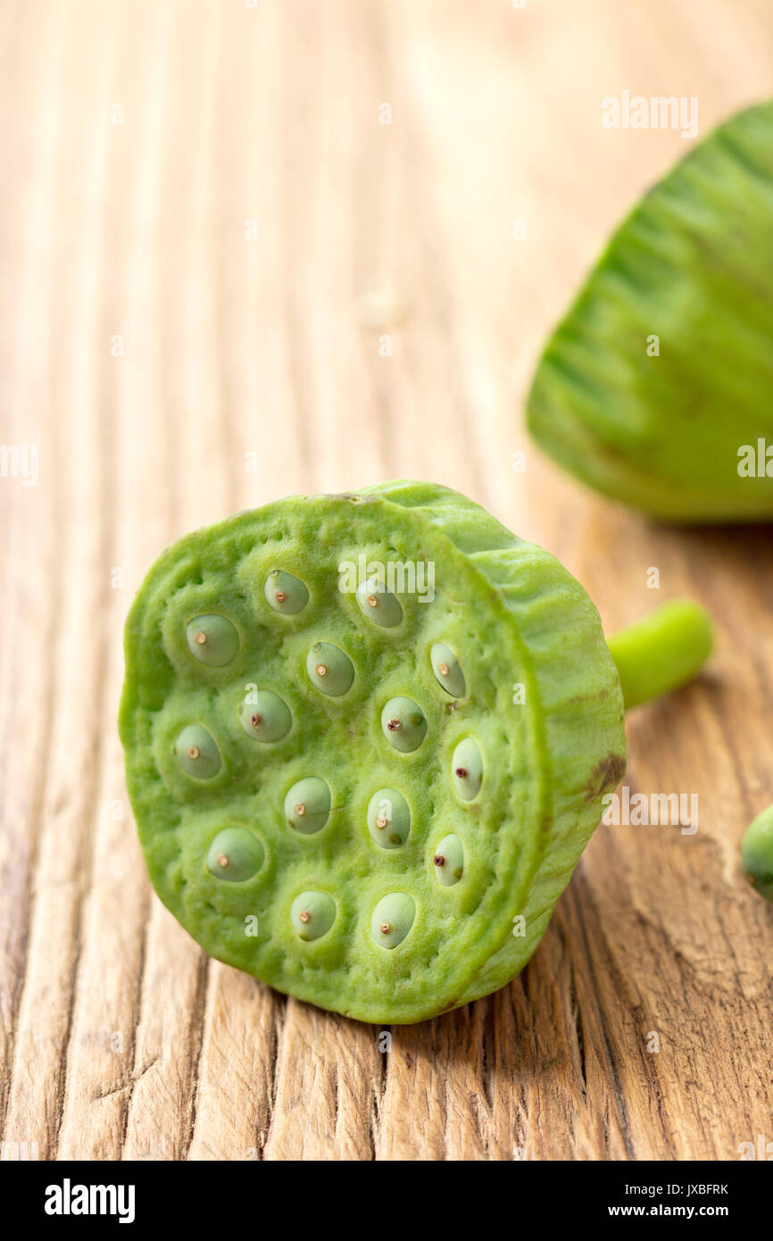 The view of two branches of fresh lotus seed on the table Stock Photo ...