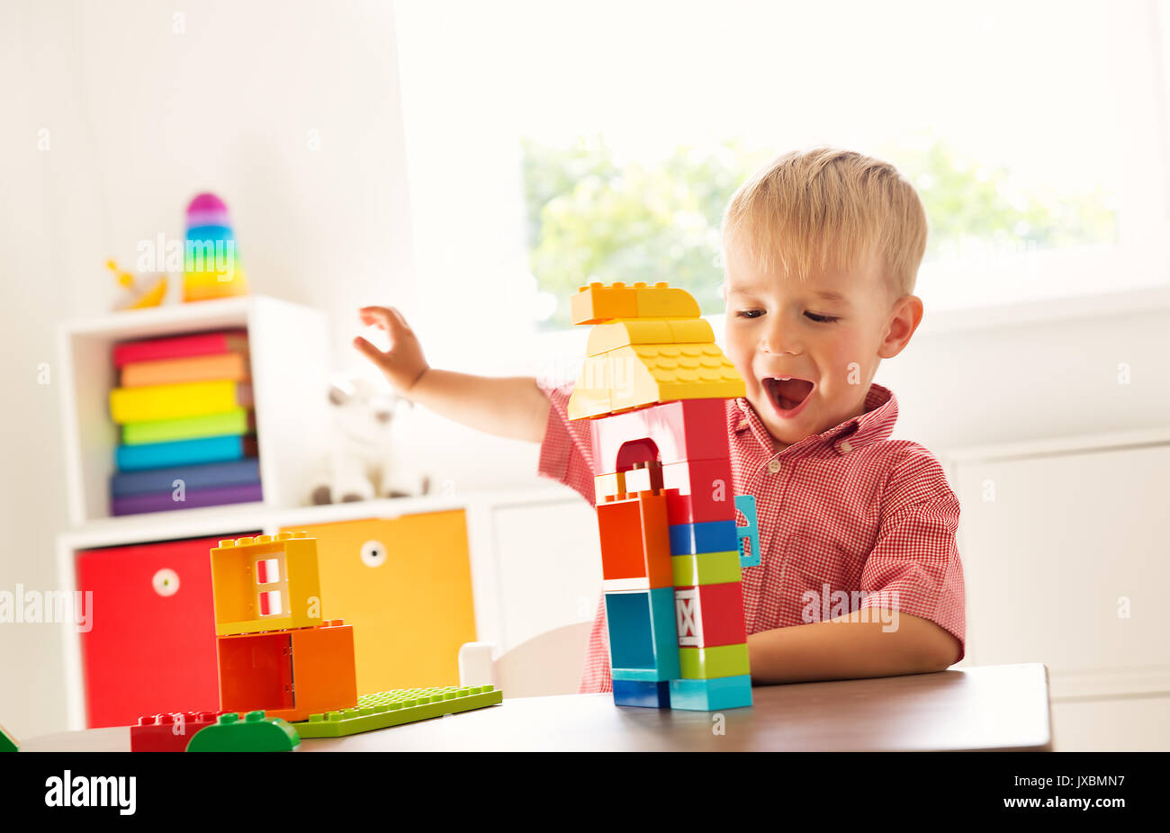 Little child playing with blocks Stock Photo - Alamy