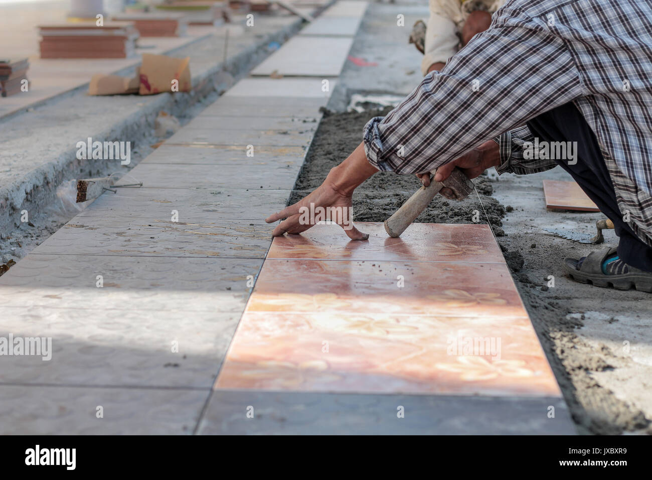 Installing floor tile hi-res stock photography and images - Alamy