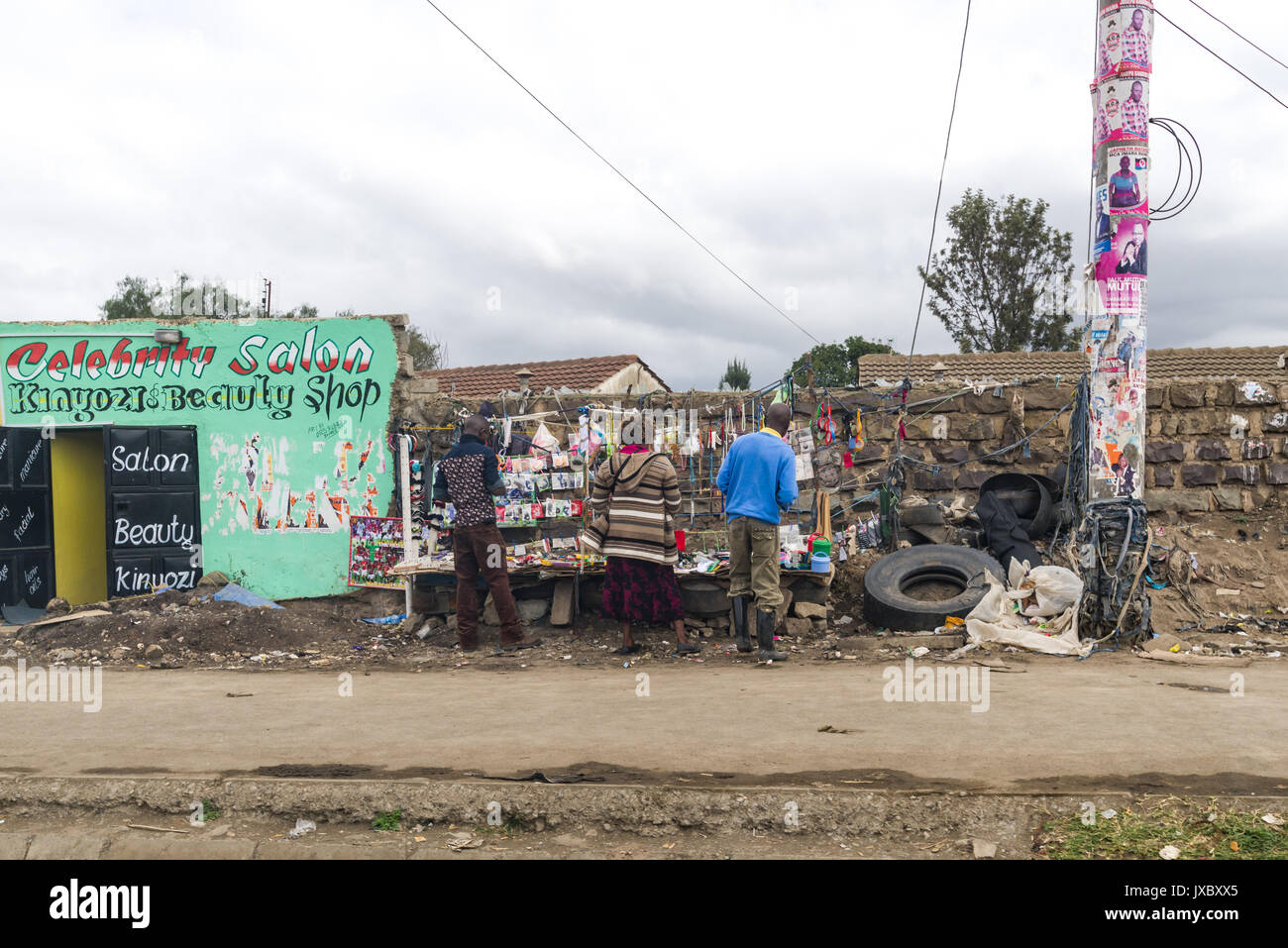 People standing by makeshift stall selling goods on roadside, Nairobi ...