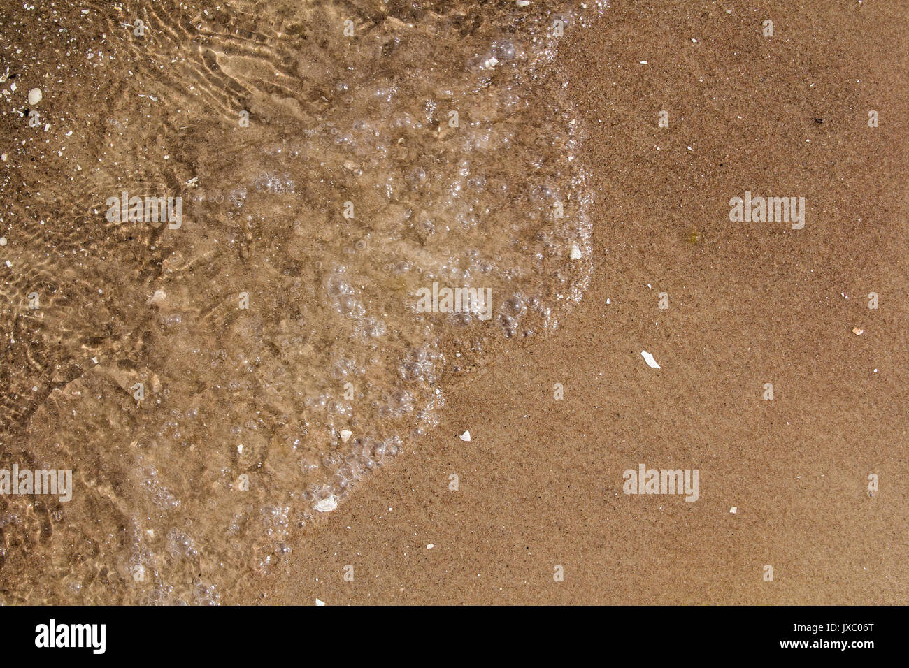 Sandy shore washed sea waves hi-res stock photography and images - Alamy