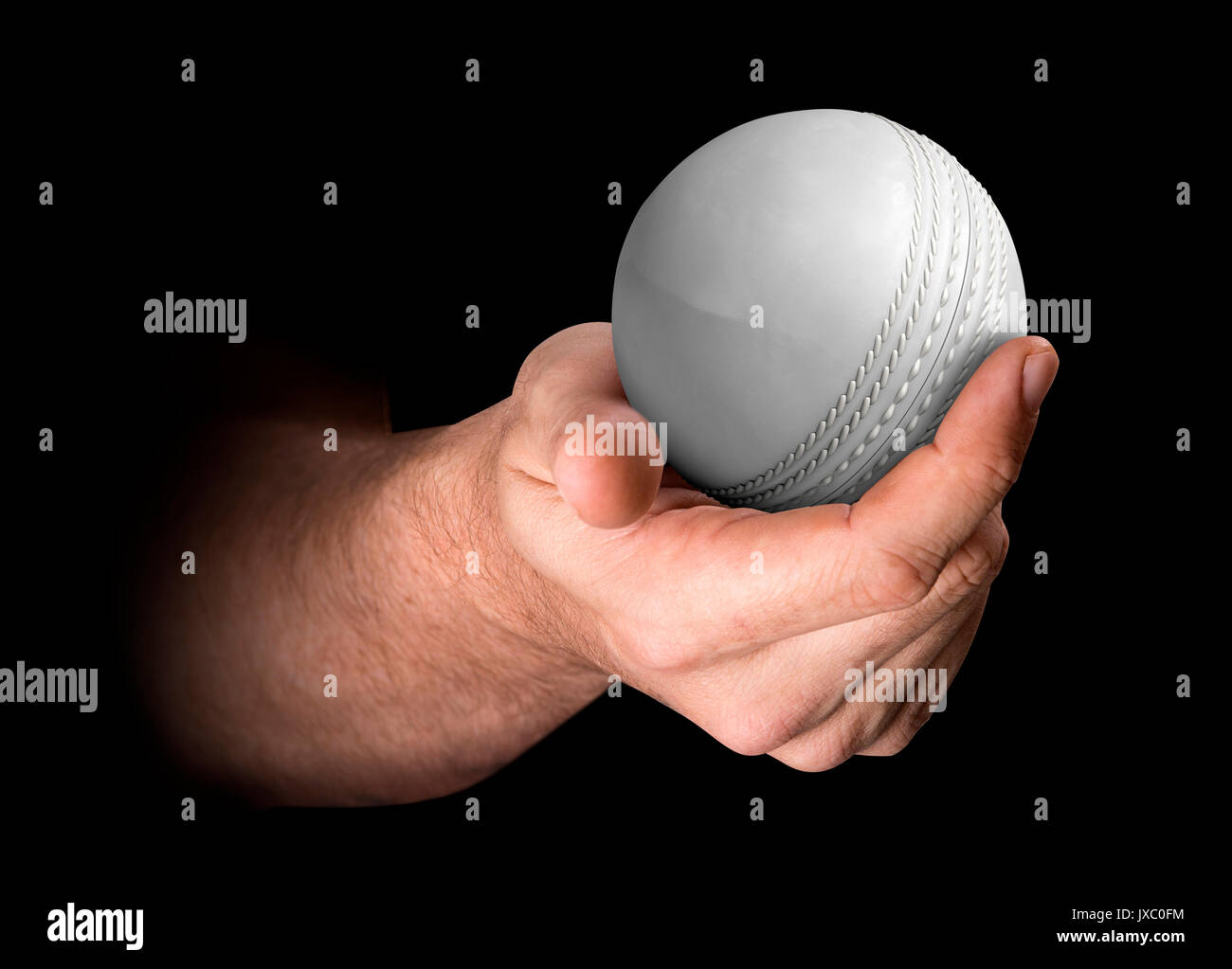 A male hand holding a cricket ball on an isolated dark background - 3D ...
