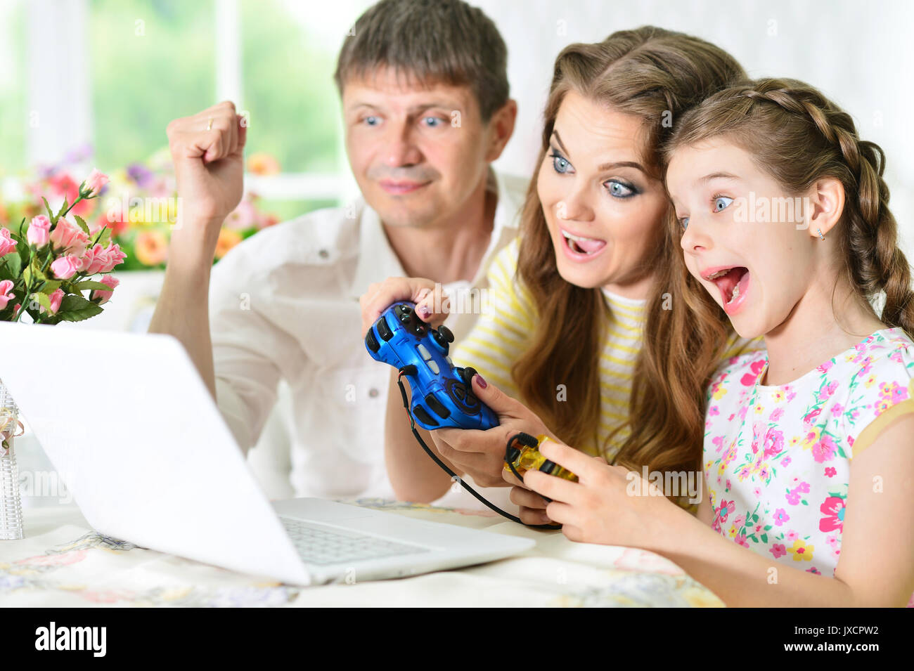 family playing computer game Stock Photo - Alamy