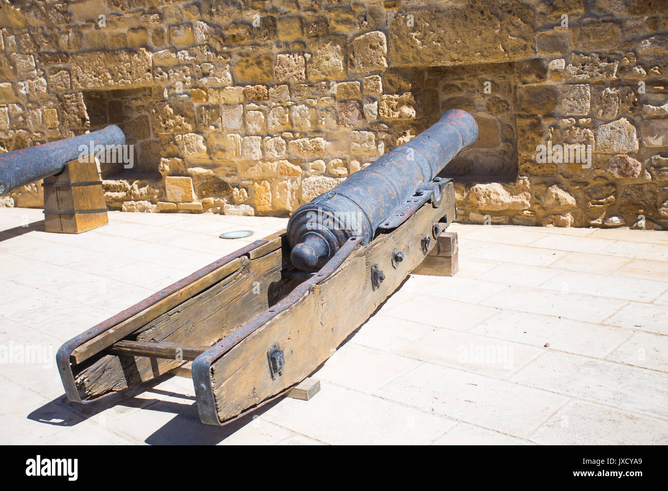 Antique cannons in the castle. Large heavy guns. Old medieval black ...