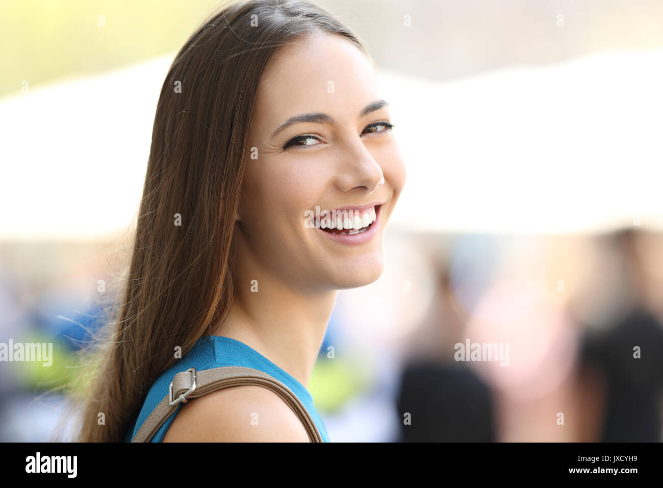 Portrait of a beautiful girl smiling at you on the street Stock Photo ...