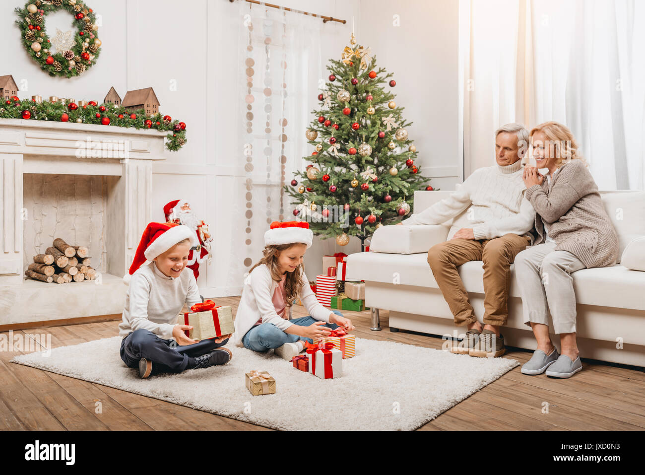 Happy family celebrating christmas hi-res stock photography and images ...
