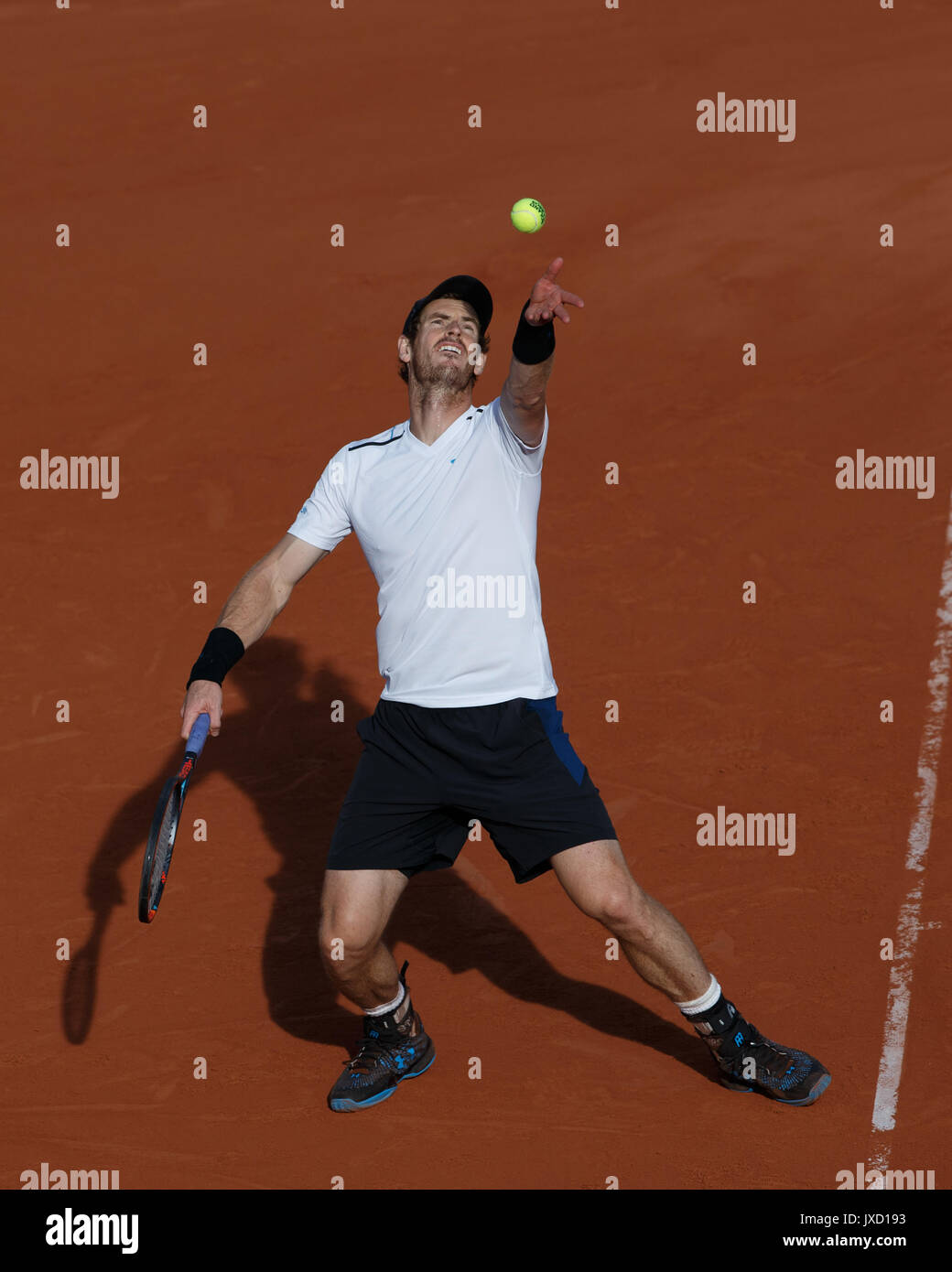 Tossing tennis ball hi-res stock photography and images - Alamy
