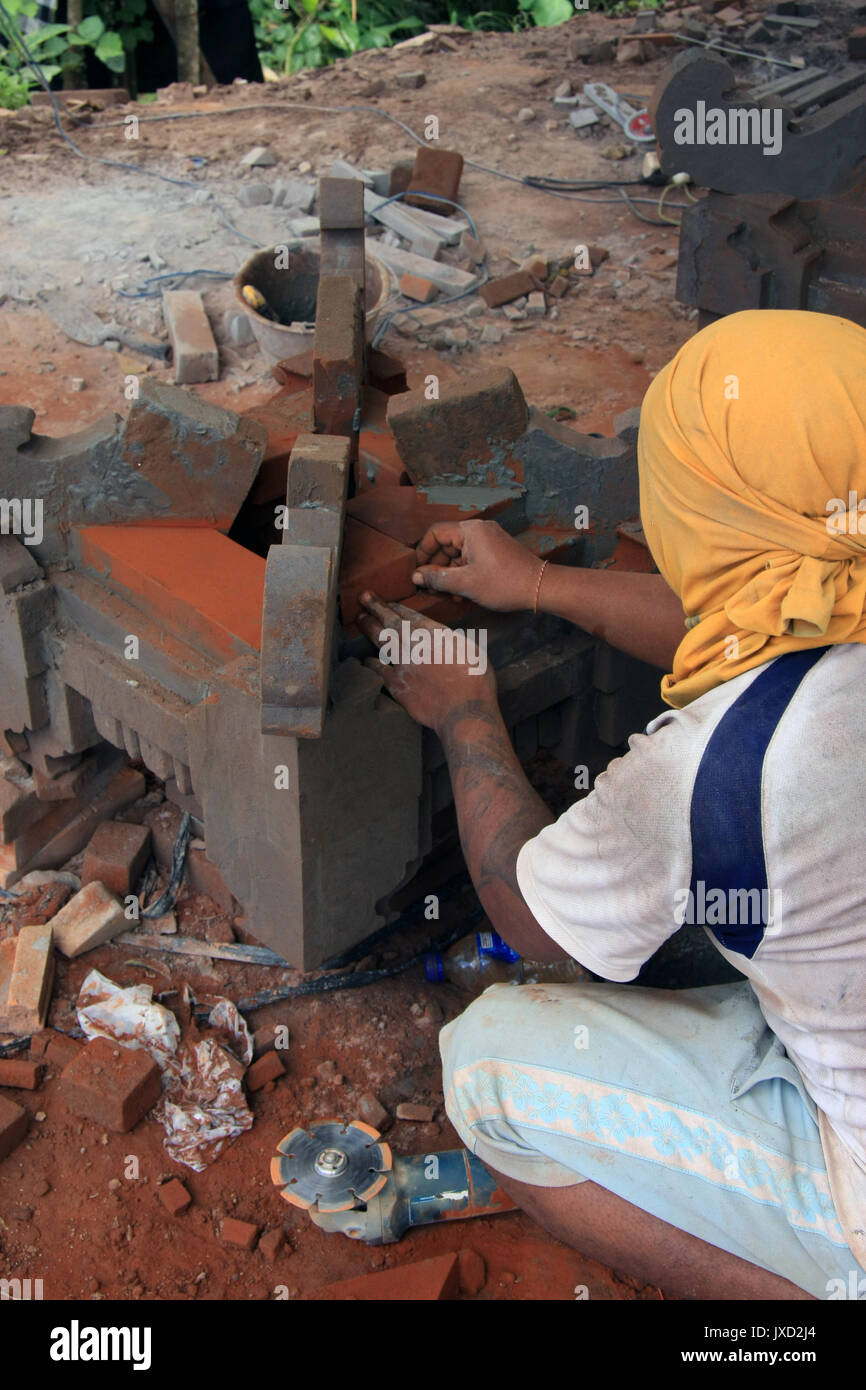 Balinese worker constructing decorative element in Bali Stock Photo - Alamy