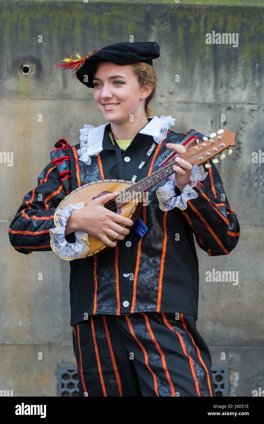 A Shakespearian Actor playing a lute in period dress at the Edinburgh ...
