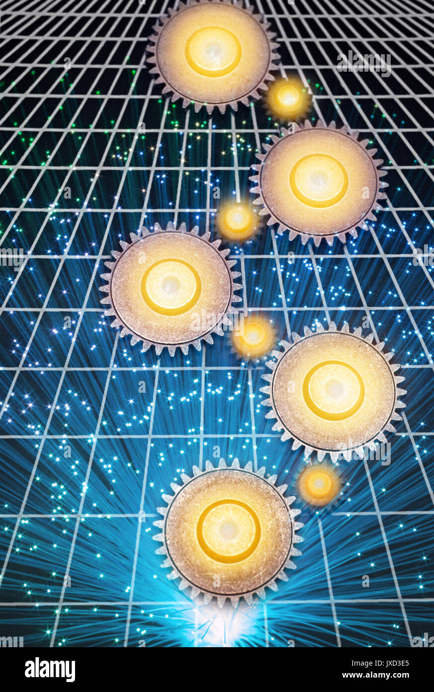 INTERLOCKING COG GEARS ON GRID OVER LIT TIPS OF FIBER OPTIC STRANDS ...