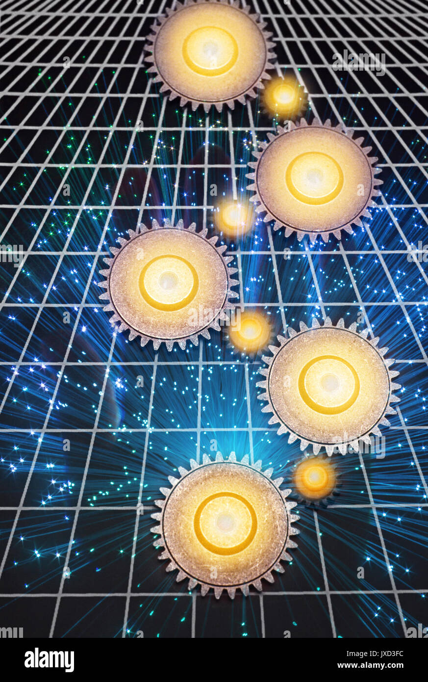 INTERLOCKING COG GEARS ON GRID OVER LIT TIPS OF FIBER OPTIC STRANDS ...