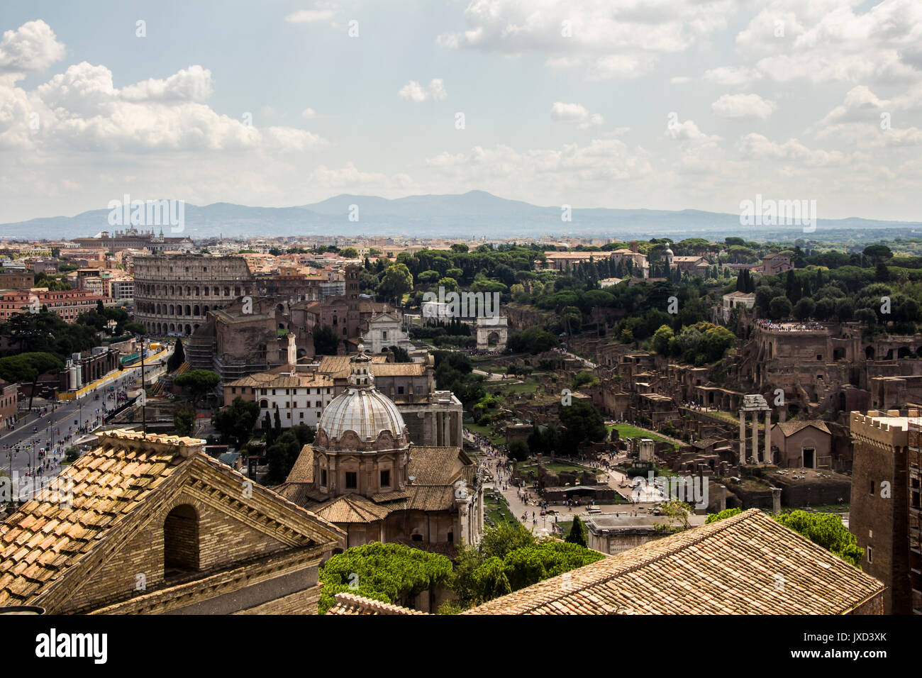 Rome overview with monument and several streets, roofs, domes, Coliseum ...