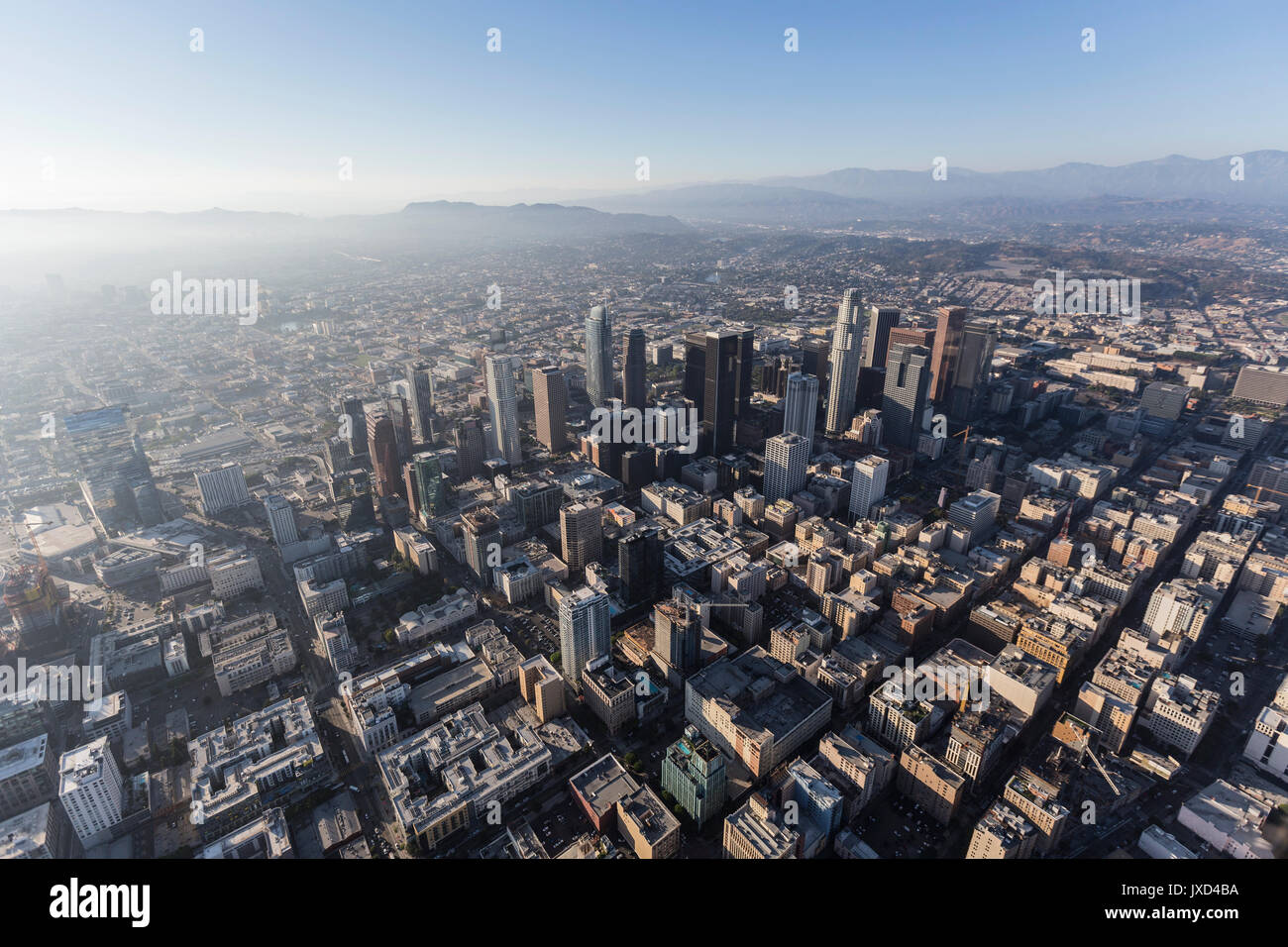 Hazy afternoon aerial view of urban downtown streets and buildings in ...