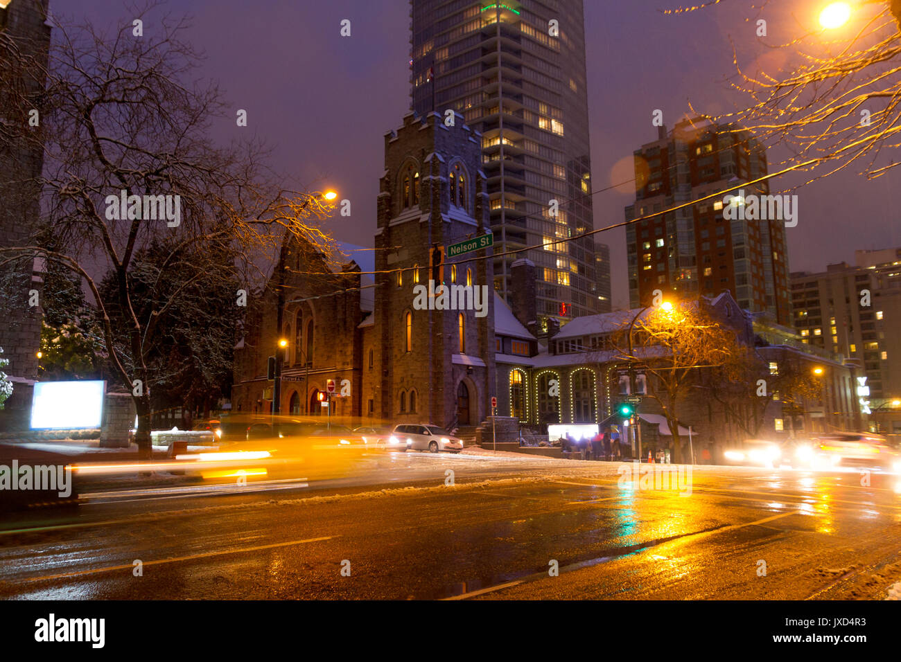 Church illuminated by lights on busy street Stock Photo - Alamy
