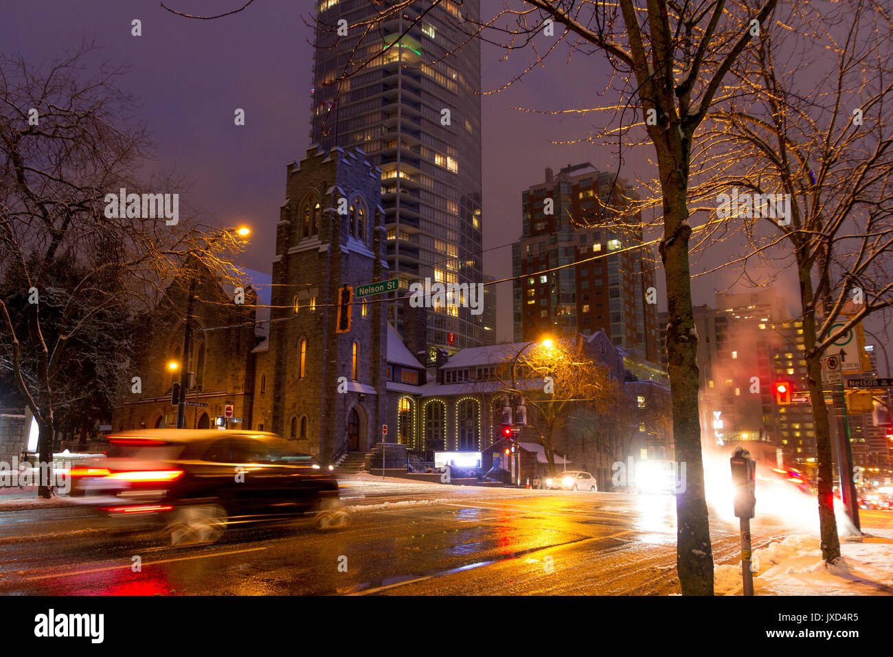 Church illuminated by lights on busy street Stock Photo - Alamy