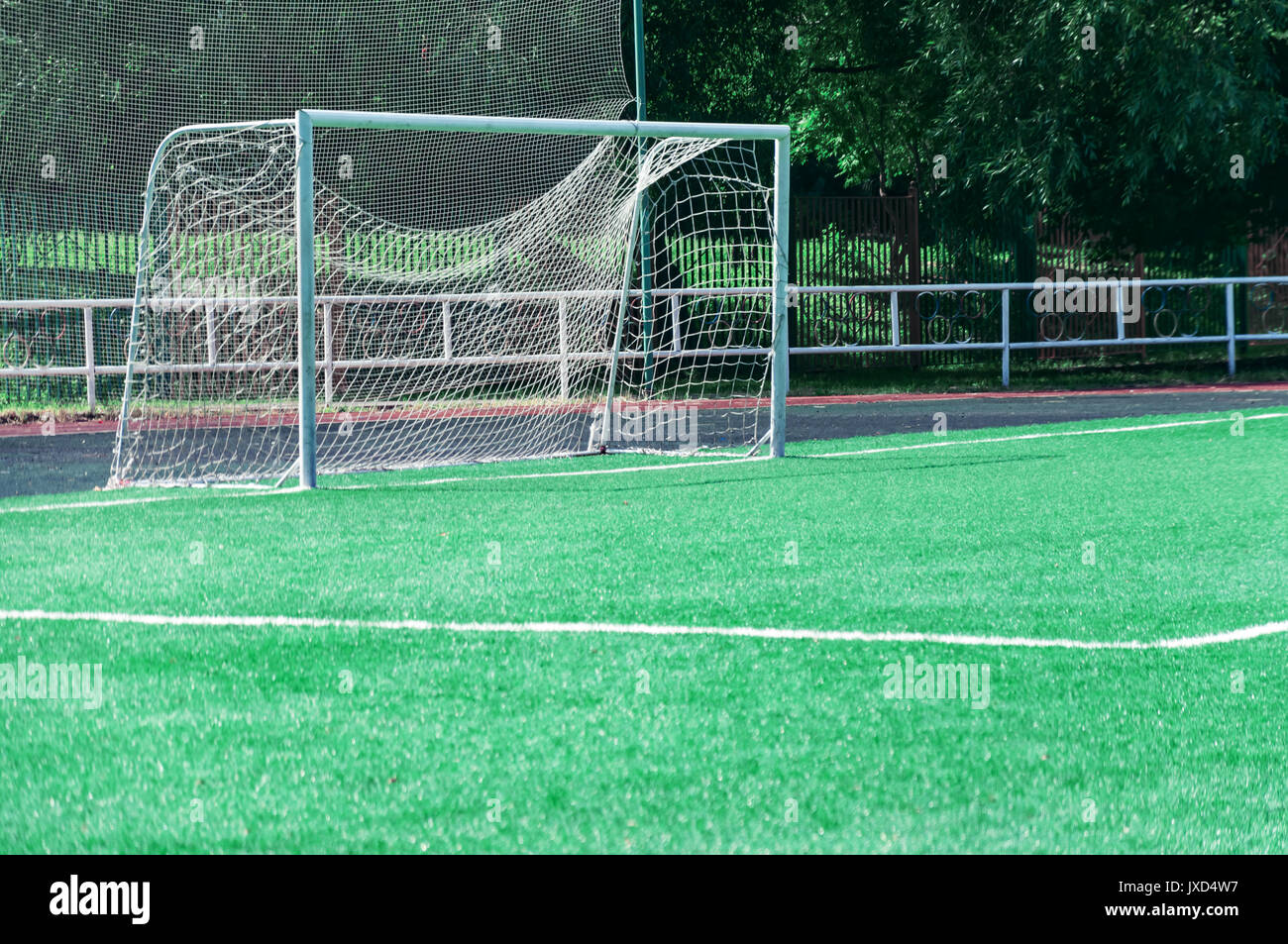 Gate on a football field with a green lawn Stock Photo - Alamy