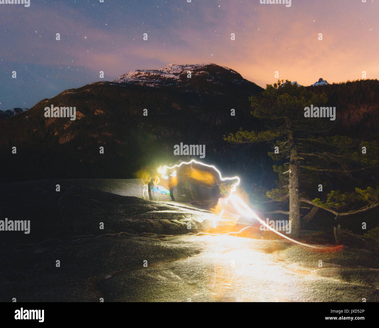 Light streak at night under the night sky Stock Photo - Alamy