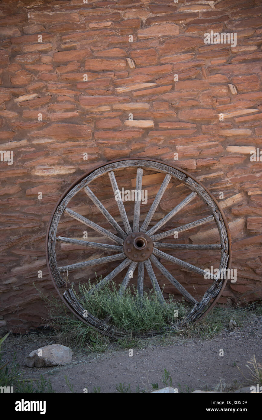 Wooden Wheel on Brick Wall Vertical Stock Photo - Alamy