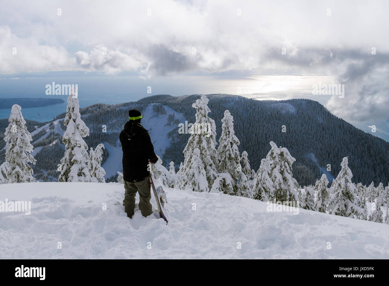 Winter seascape with island, mountains in snow and clouds Stock Photo ...