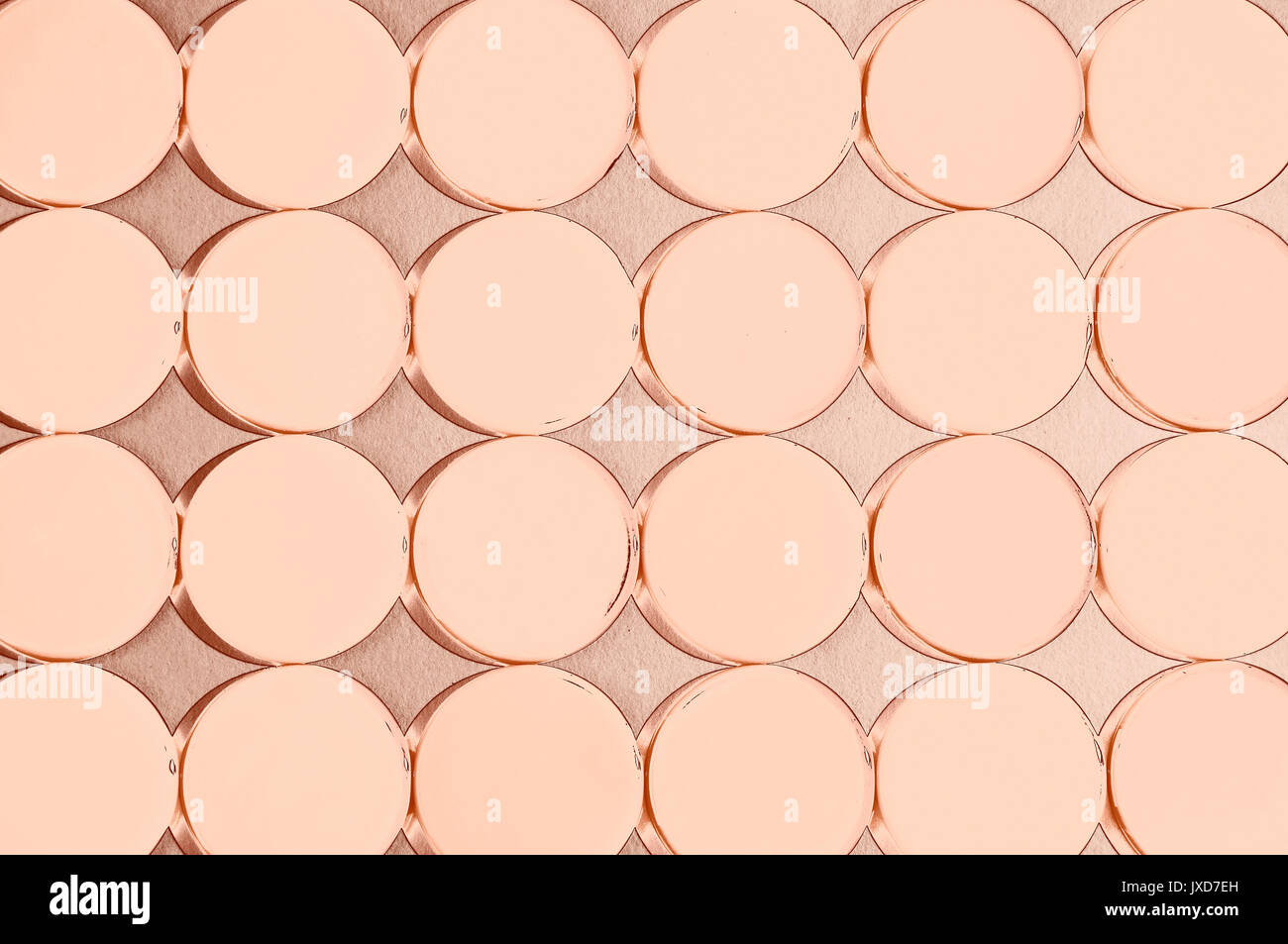 Pale pink plastic counters in srudio setting Stock Photo - Alamy