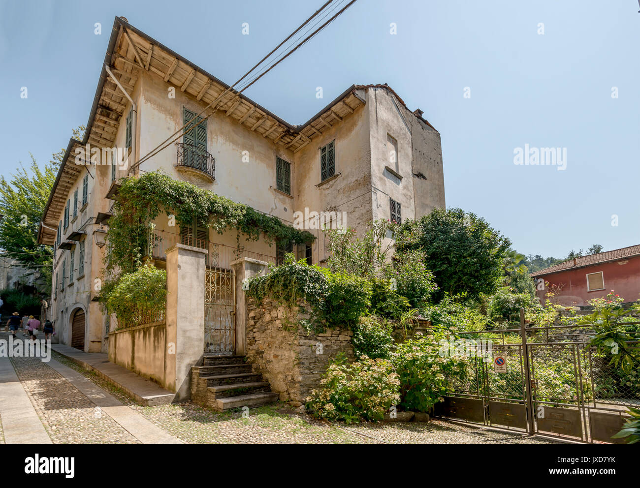 lush green vegetation on old building in historical touristic village ...