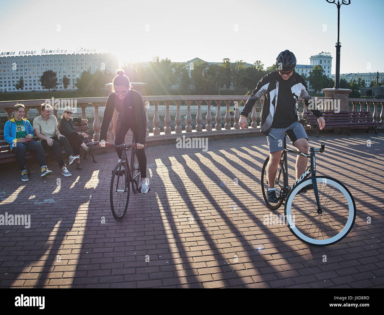Young people on bicycles trying to keep his balance Stock Photo - Alamy