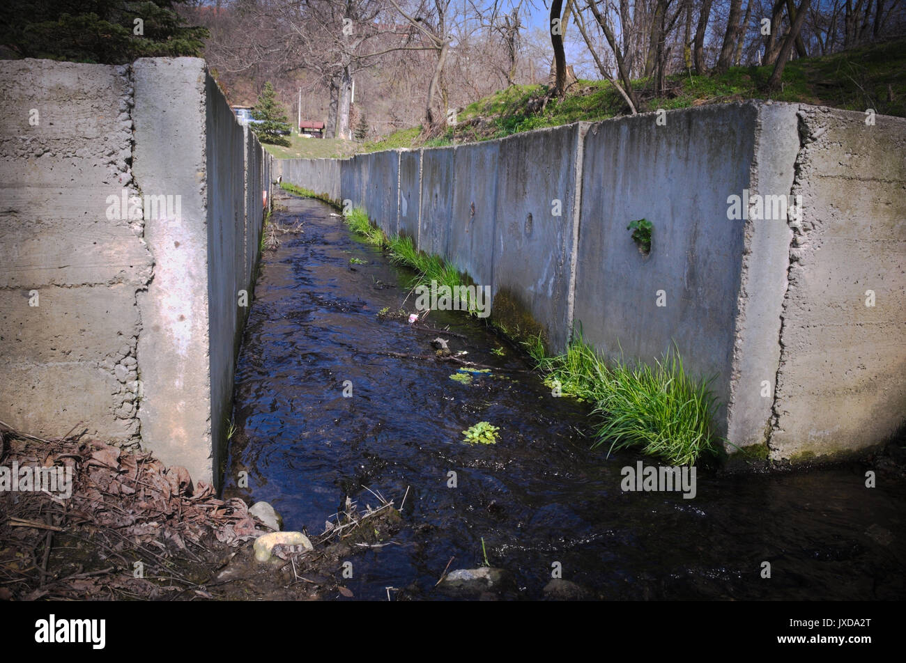 Water stream surrounded by concrete wall Stock Photo - Alamy
