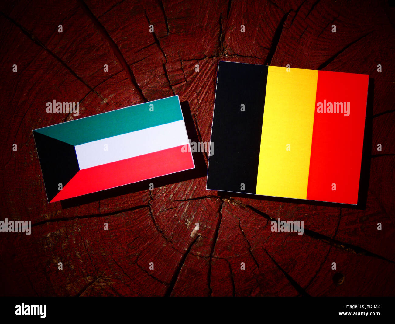 Kuwaiti flag with Belgian flag on a tree stump isolated Stock Photo - Alamy