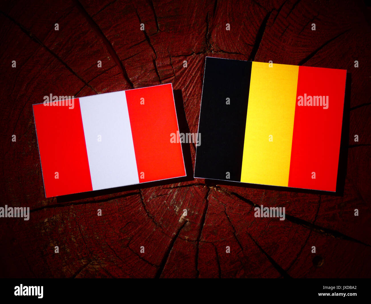 Peruvian flag with Belgian flag on a tree stump isolated Stock Photo ...