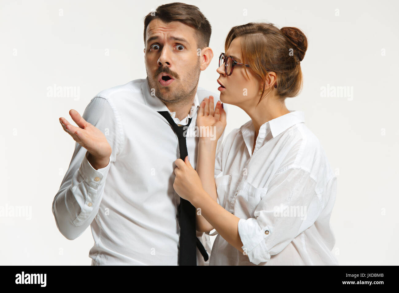 The business man and woman communicating on a gray background Stock ...