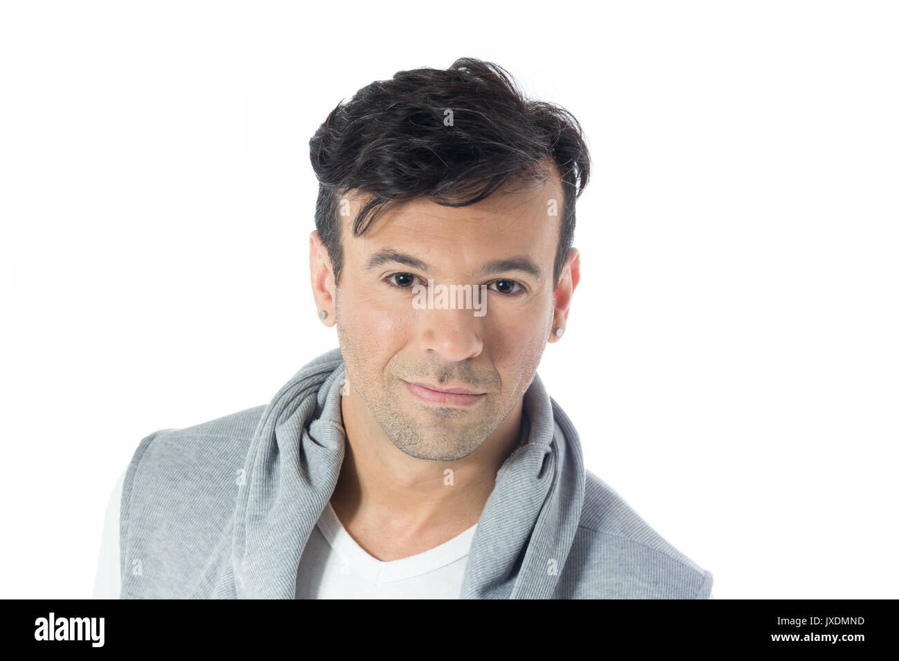 Portrait of man with a slight smile. Handsome brazilian wearing gray ...