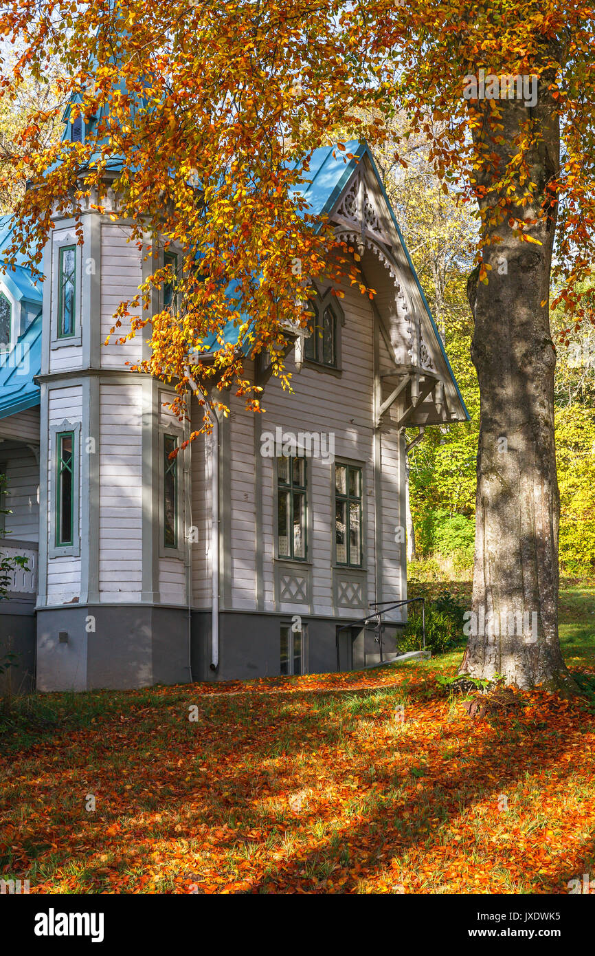 Old wooden house with autumn colors in the garden Stock Photo - Alamy