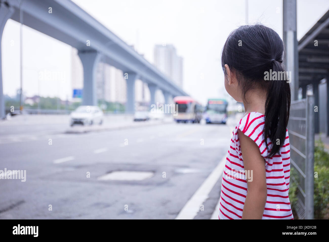 Asian female student at bus stop hi-res stock photography and images ...