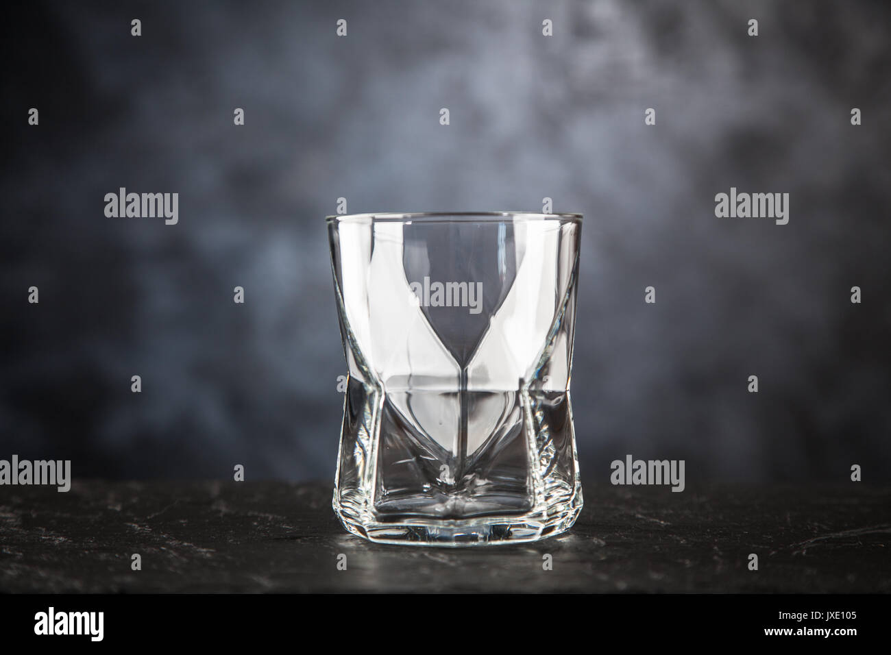Empty glass on dark background Stock Photo - Alamy