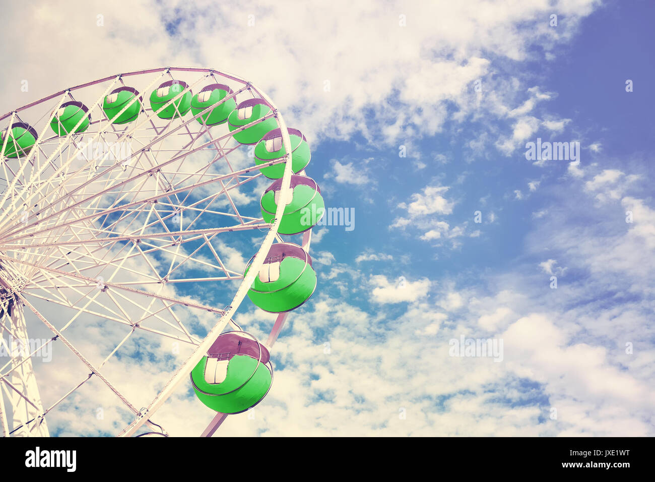 Retro toned picture of a Ferris wheel, space for text Stock Photo - Alamy