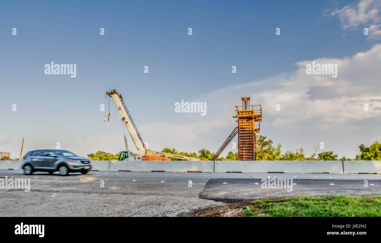 A car speeds past a highway overpass construction site Stock Photo - Alamy