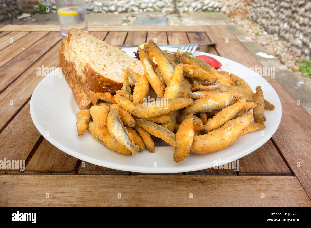 A plate of deep fried Whitebait Stock Photo - Alamy