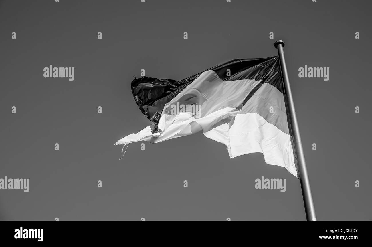 German Flag waving in the wind Stock Photo - Alamy