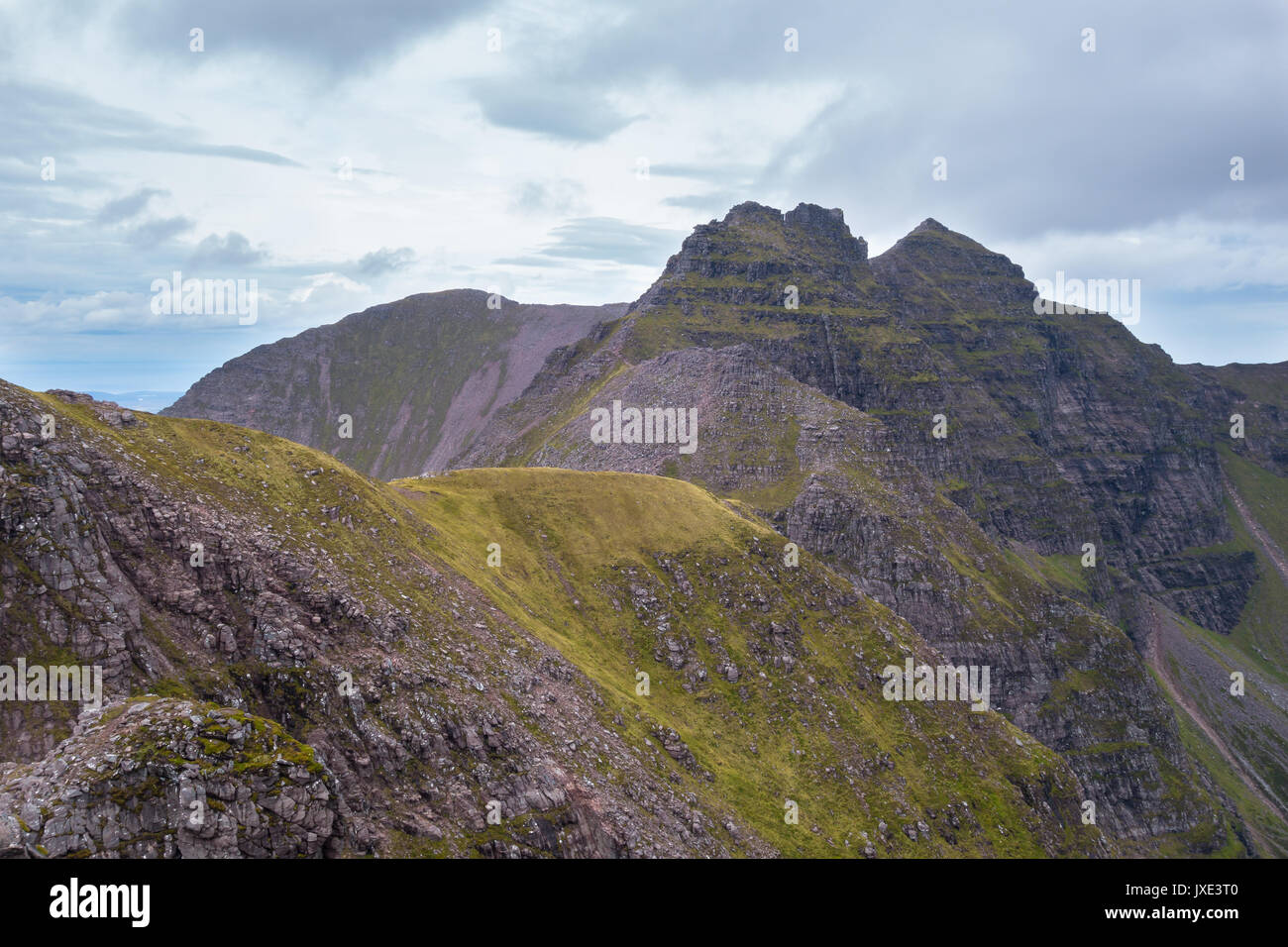 The rock ridge leading to the two An Teallach Munro peaks Bidein a ...