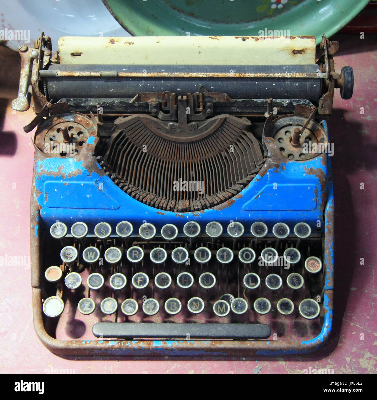 Old antique blue typewriter in poor condition Stock Photo - Alamy