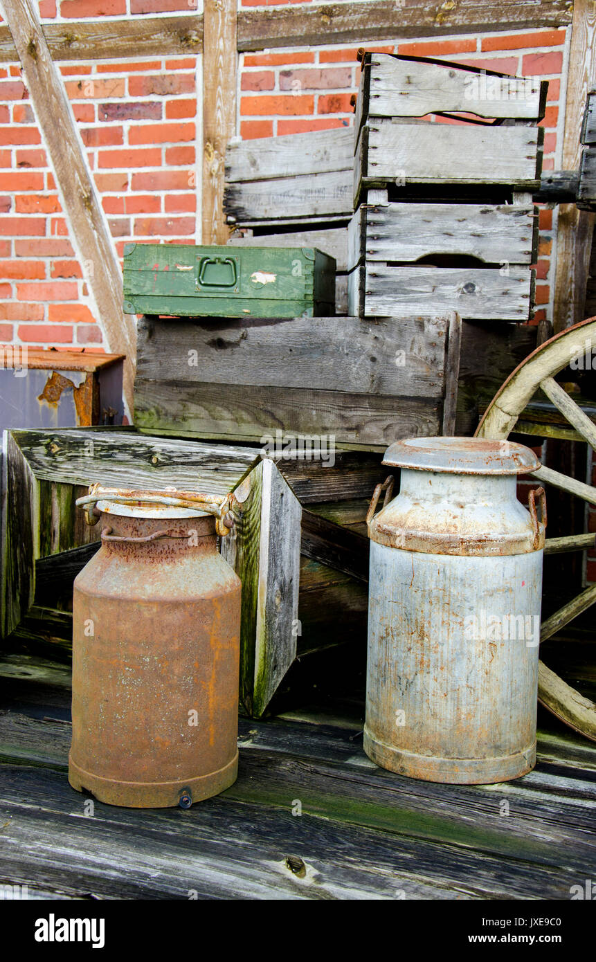 Arrangement of old stuff - Metal milk barrel, wooden boxes, fruit cases ...