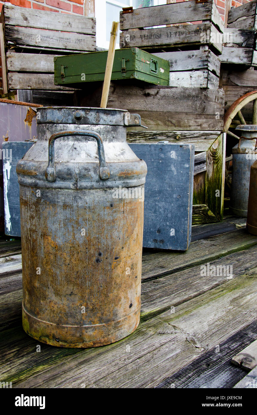 Arrangement of old stuff - Metal milk barrel, wooden boxes, fruit cases ...