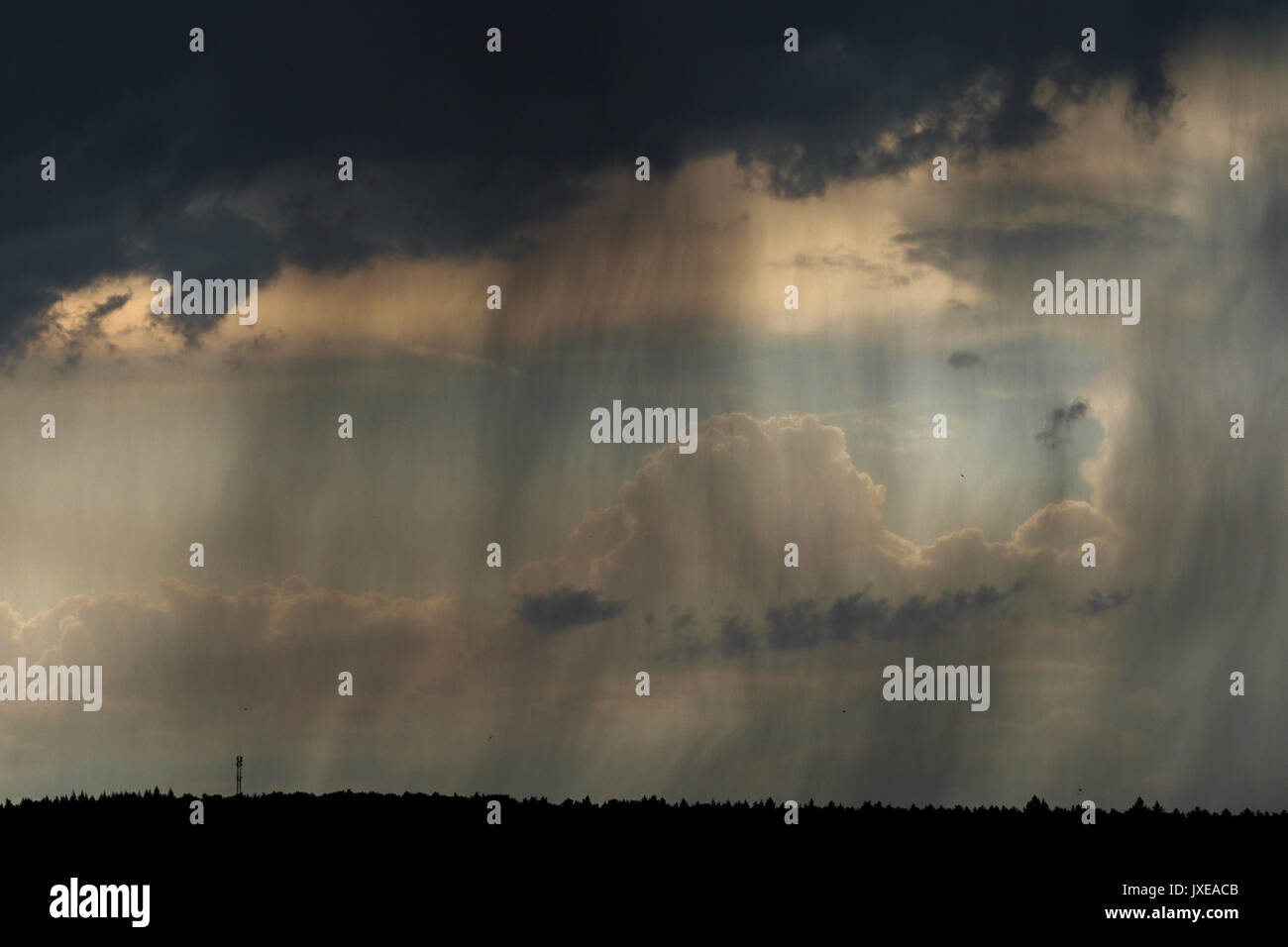 Ebing, Germany. 15th Aug, 2017. Dark thunder clouds and rain can be ...
