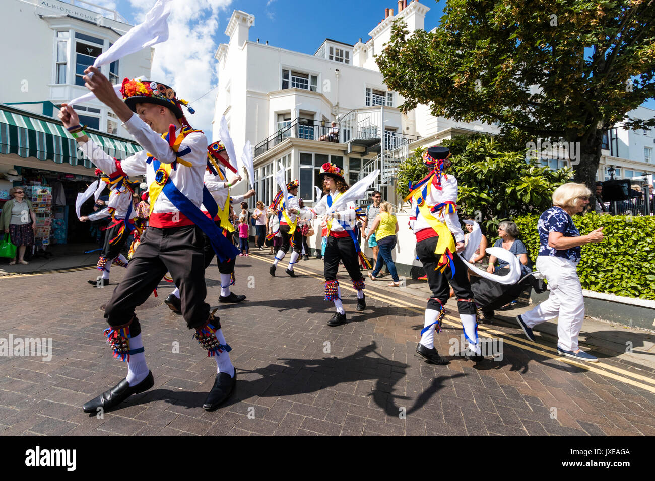 Traditional English folk dancers, Moulton Morris men dancing in small ...