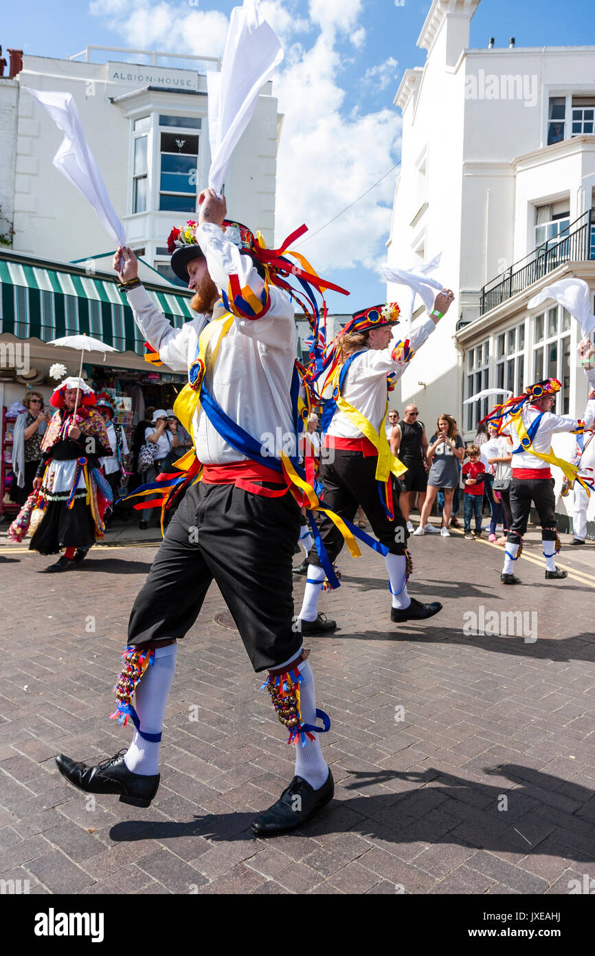 Traditional English folk dancers, Moulton Morris men dancing in small ...