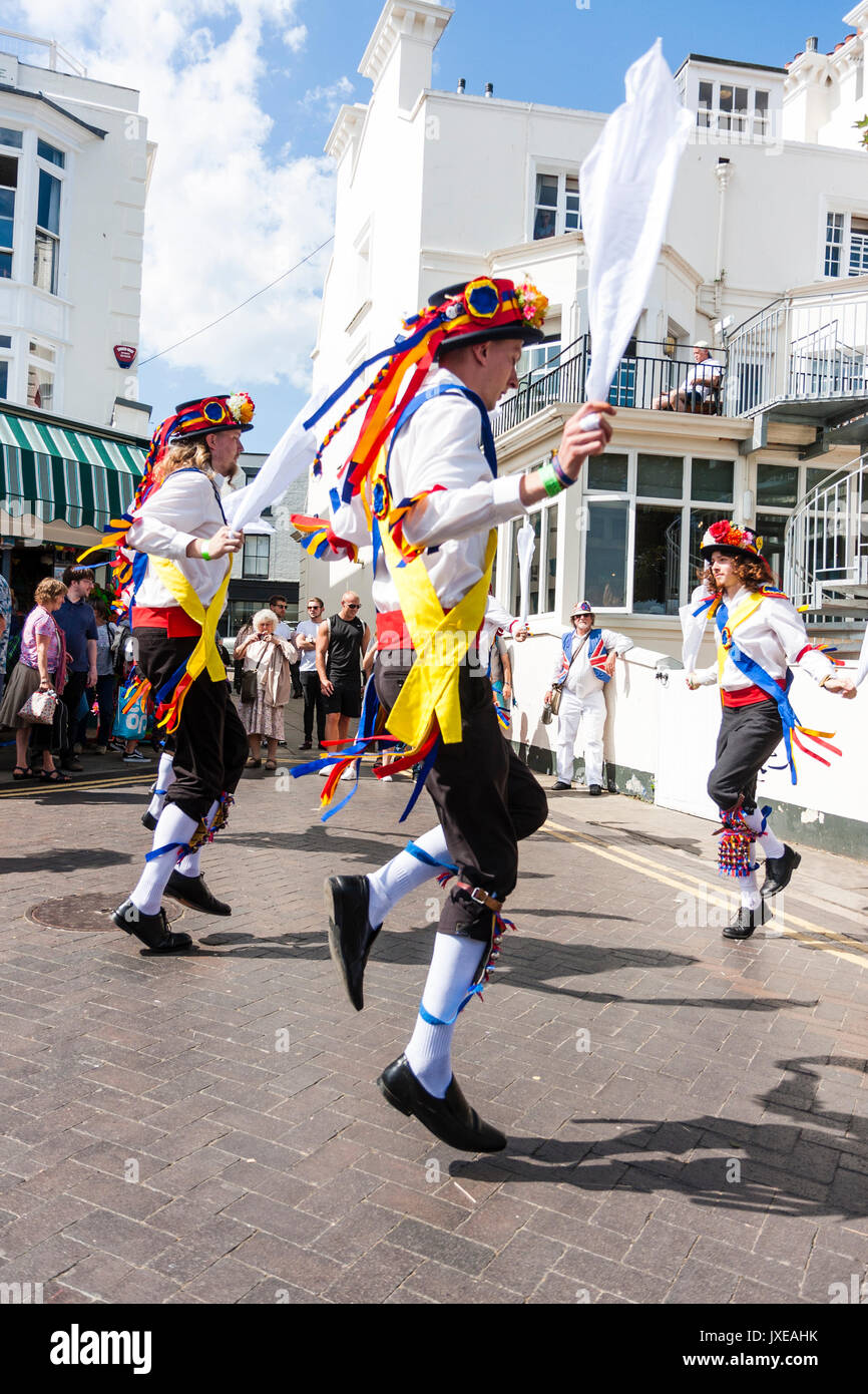 Traditional English folk dancers, Moulton Morris men dancing in small ...