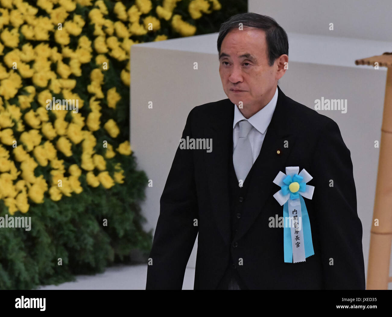 Japan's Chief Cabinet Secretary Yoshihide Suga attends the memorial ...
