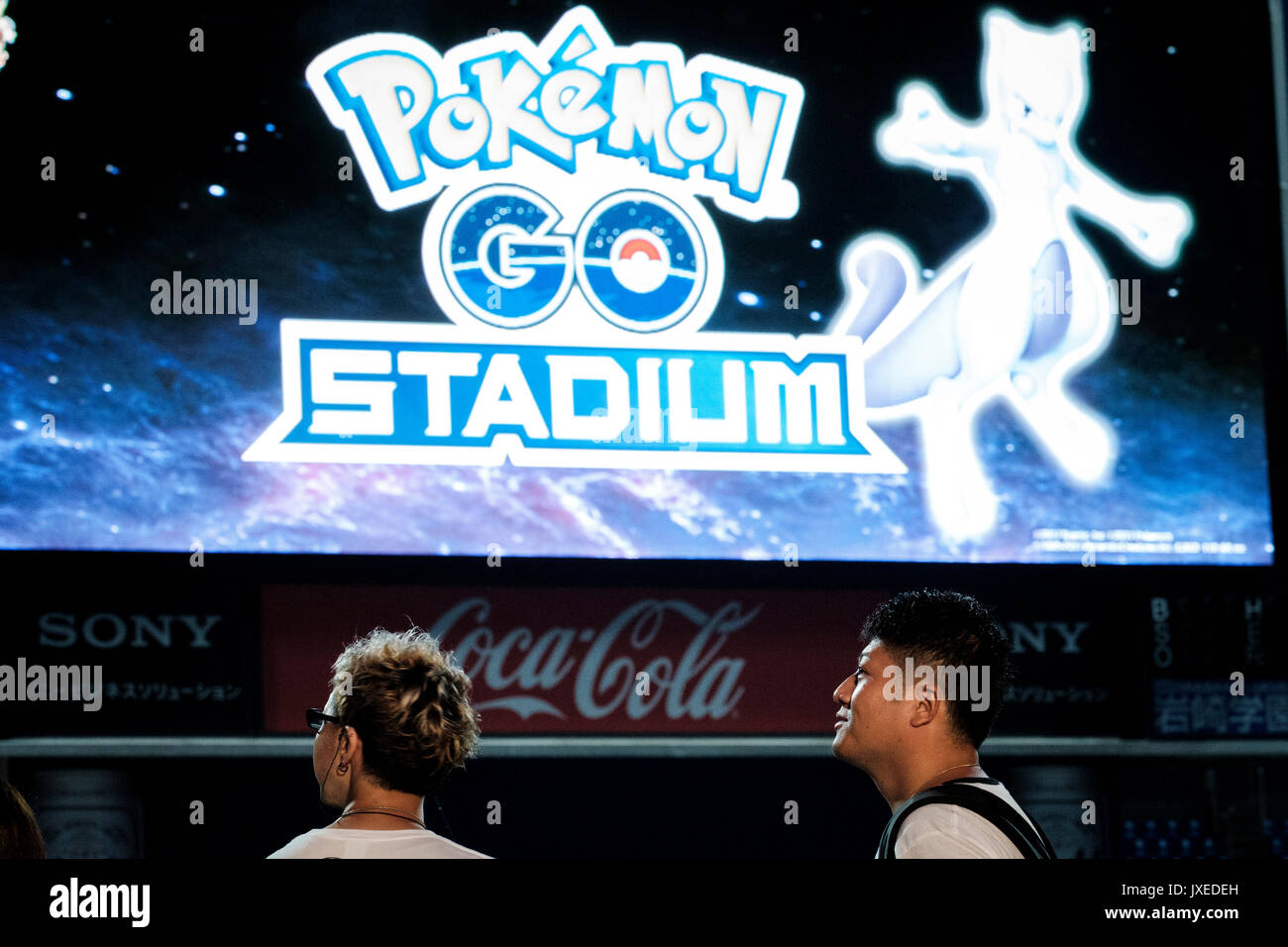AUGUST 14, 2017 Two men look at a screen during the Pokemon Go stadium ...