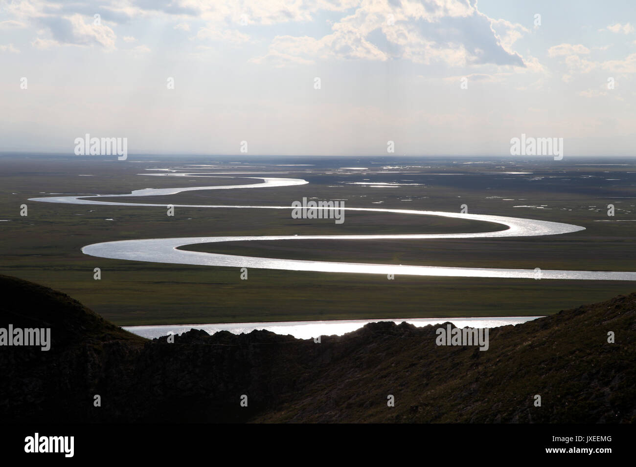 Xinjiang, China. 15th Aug, 2017. Xinjiang, Winding river across the ...